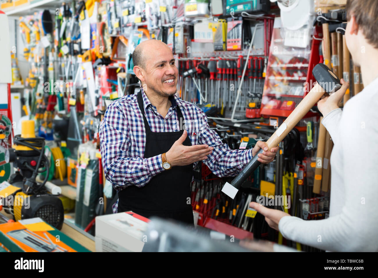 european salesman showing different tools and instruments in ...