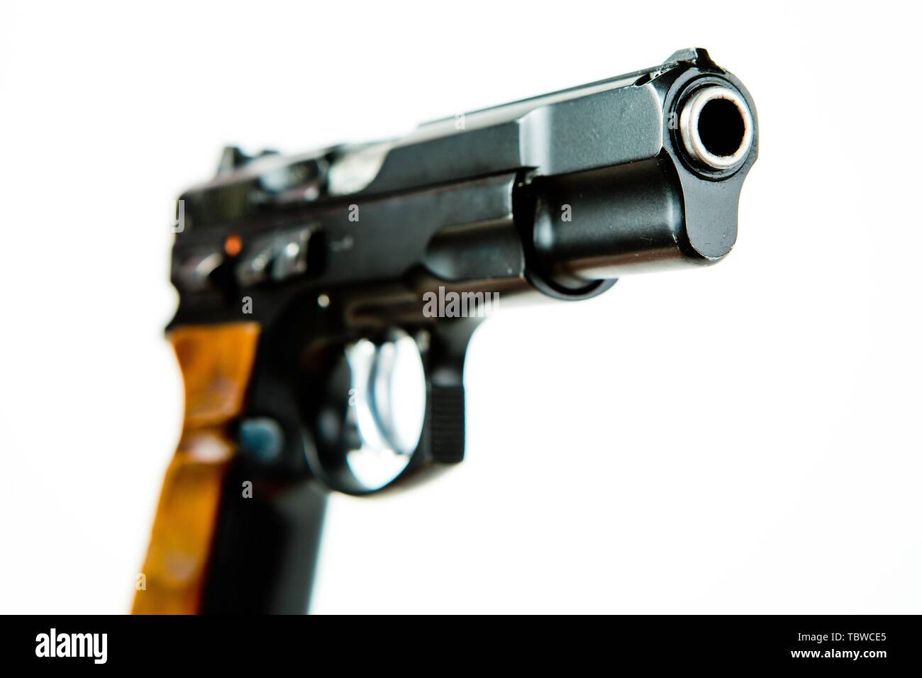 Front side view of black semi automatic pistol with wooden grip Stock ...