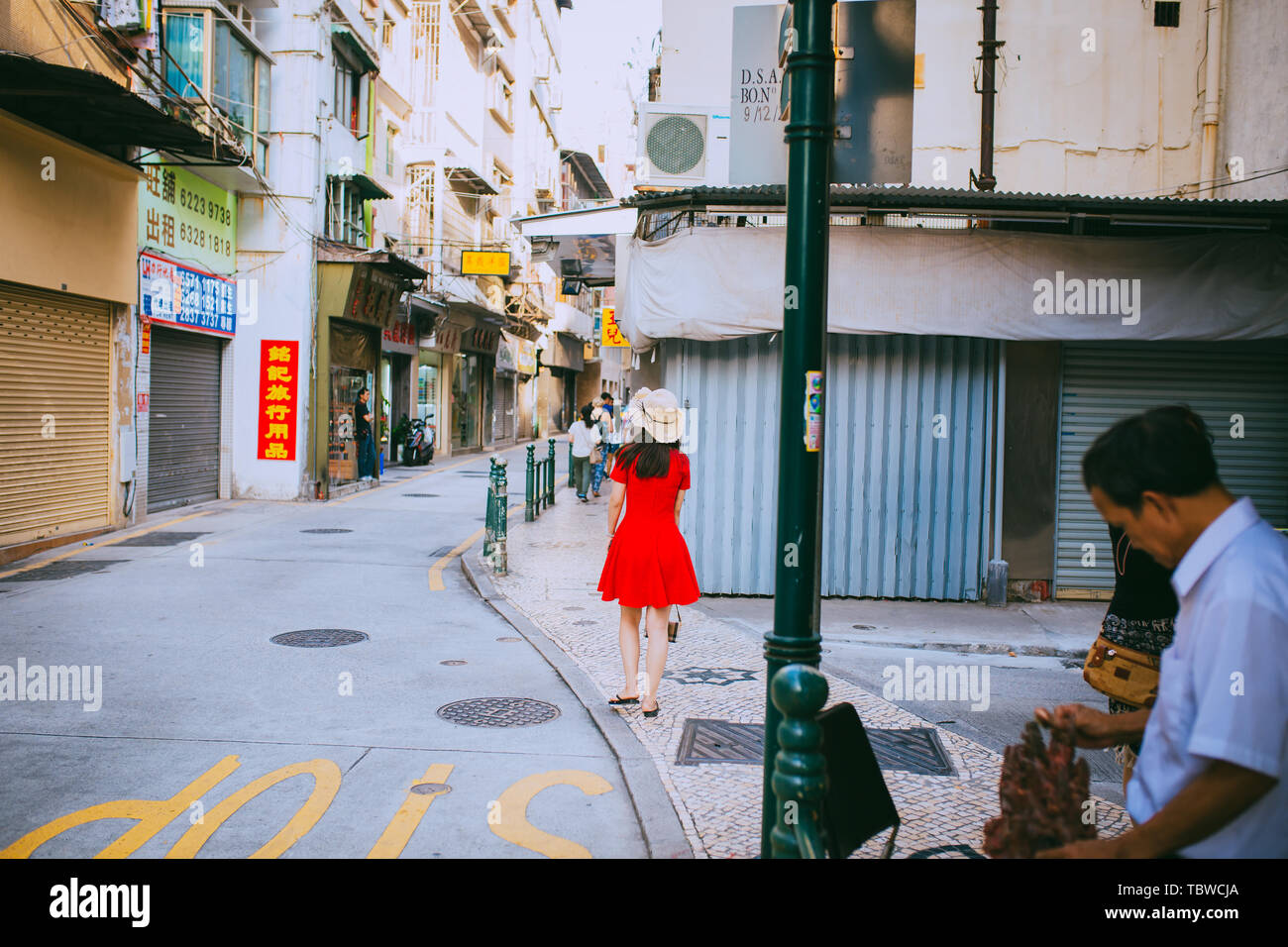 Red dress tour the big three buses Stock Photo - Alamy