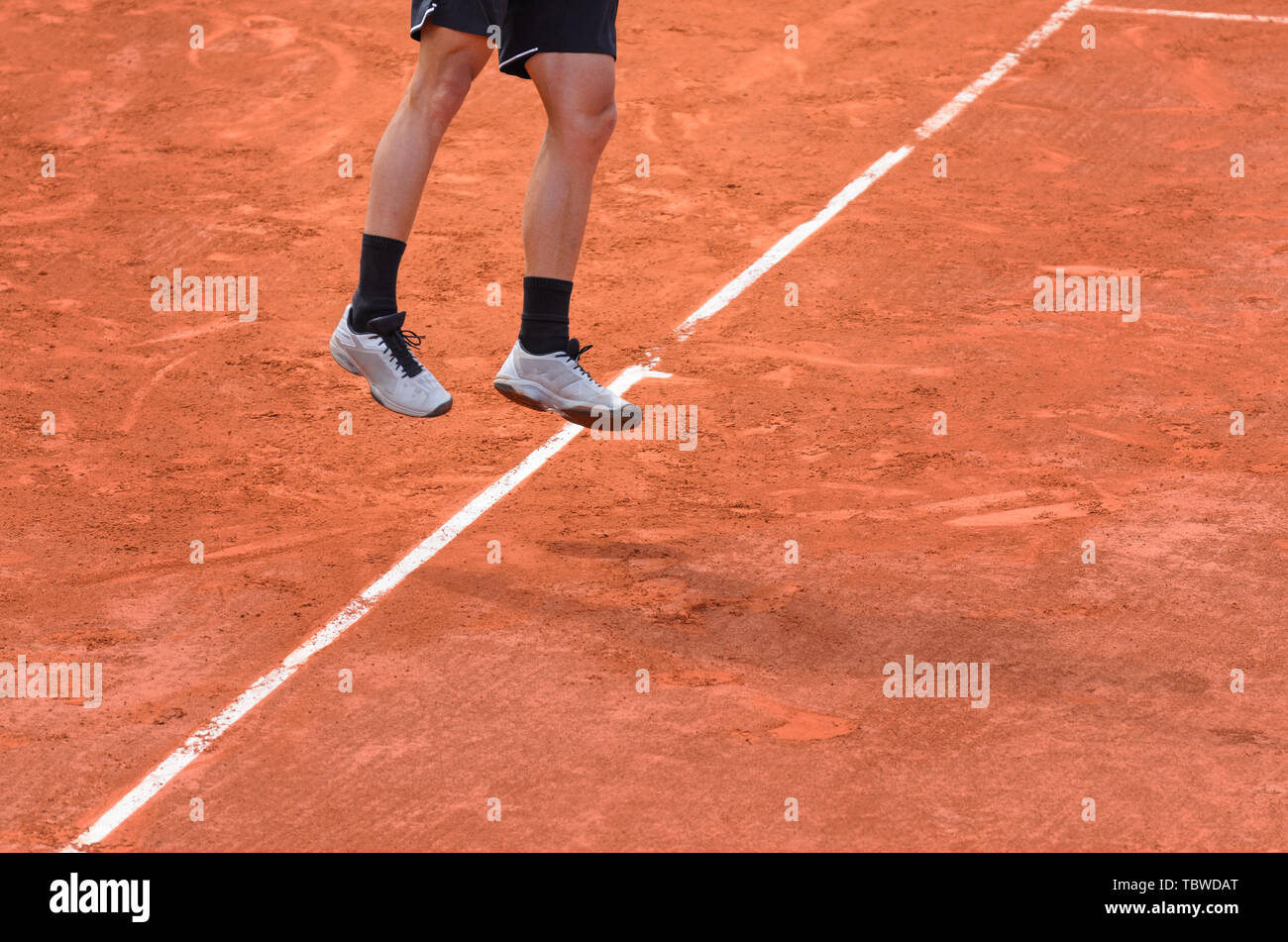Feet of a male tennis player in jump after shot, service Stock Photo ...