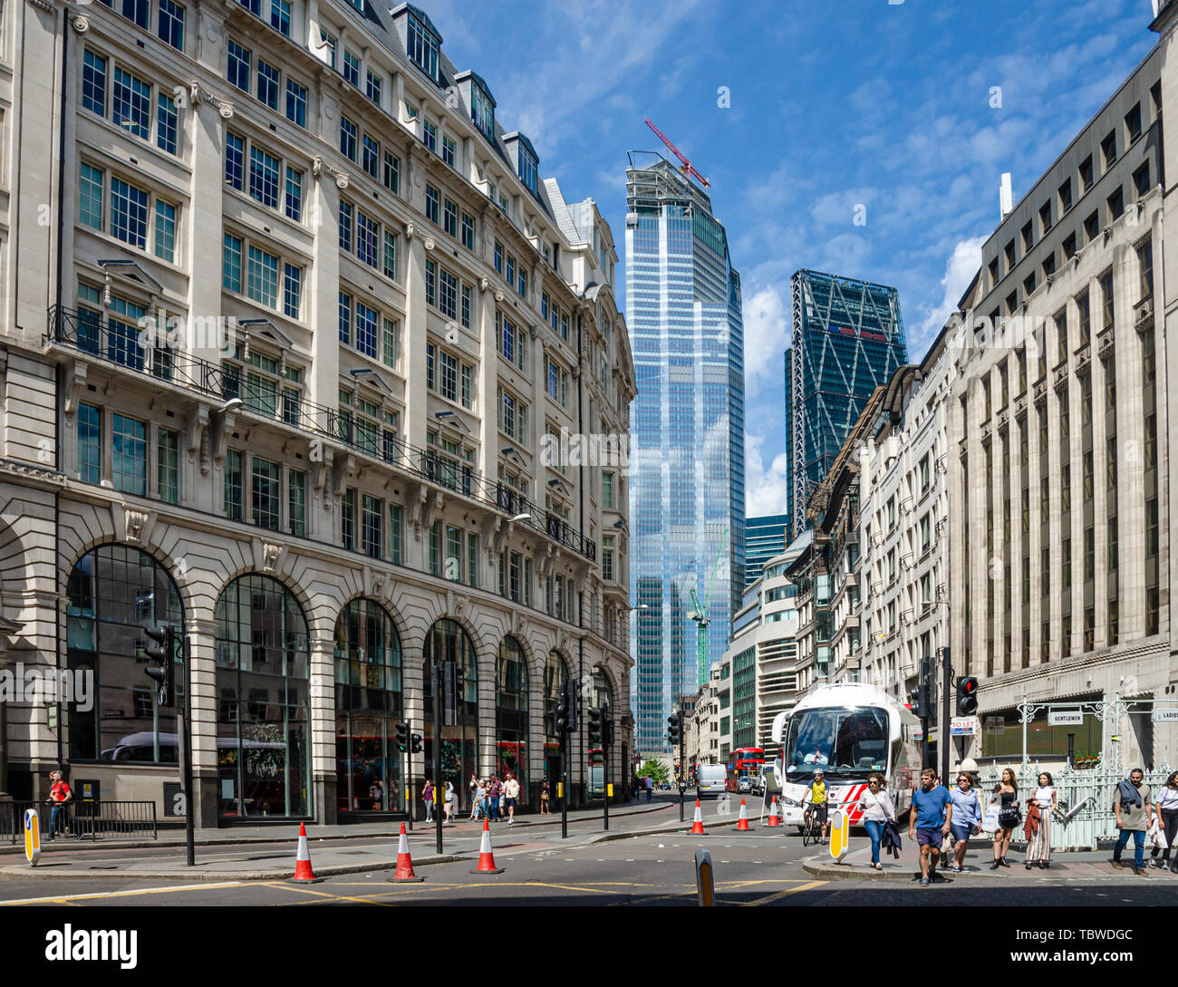 A London street with old buildings in the foreground with modern ...