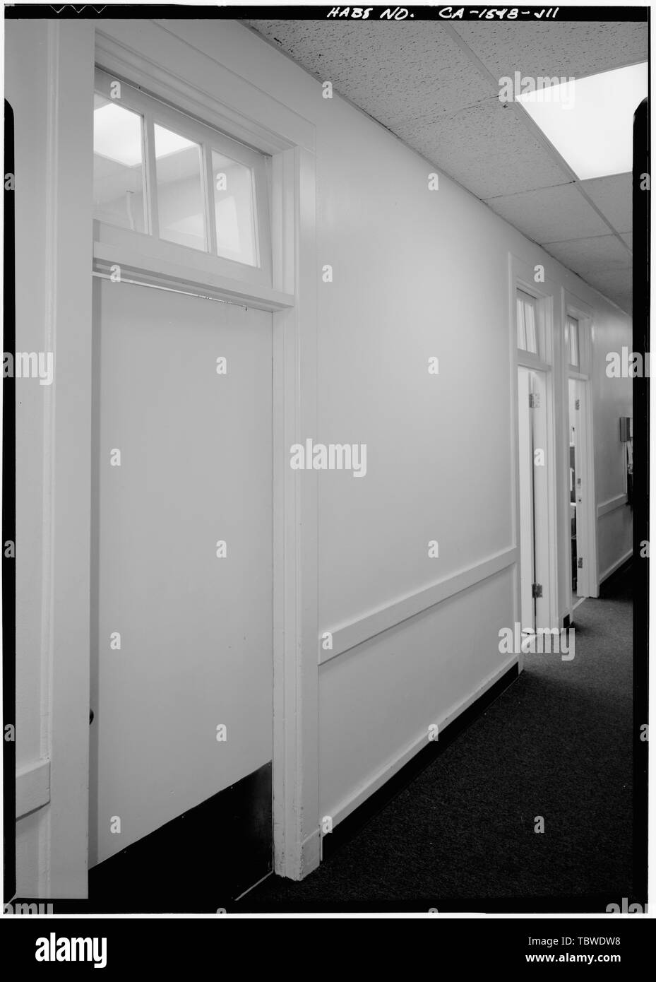MAIN FIRST FLOOR CORRIDOR WITH UNPAINTED TRANSOM WINDOWS U.S. Naval ...