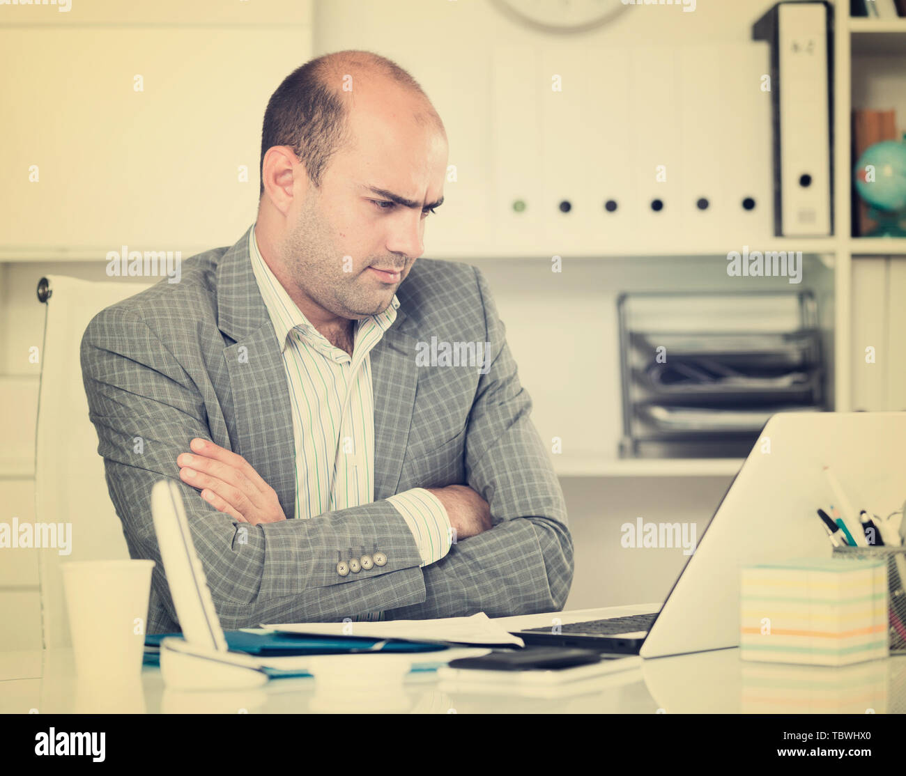 Sad businessman thinking about work in the modern office Stock Photo ...