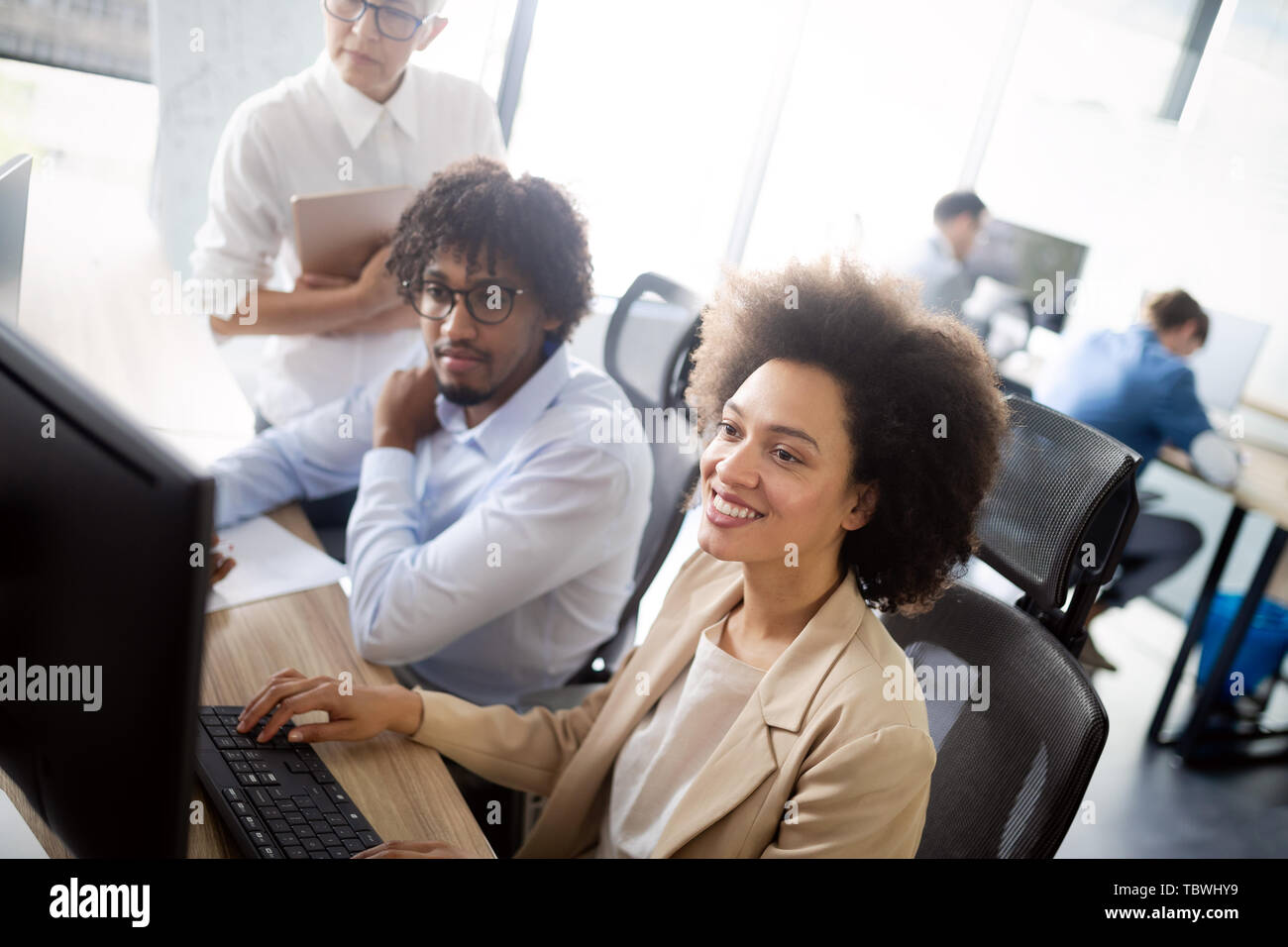Programmer working in a software developing company office Stock Photo ...