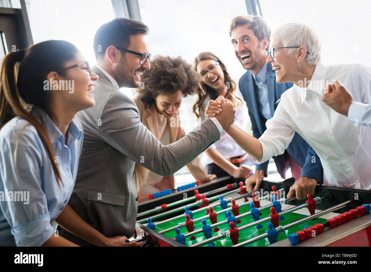 Employees playing table football hi-res stock photography and images ...