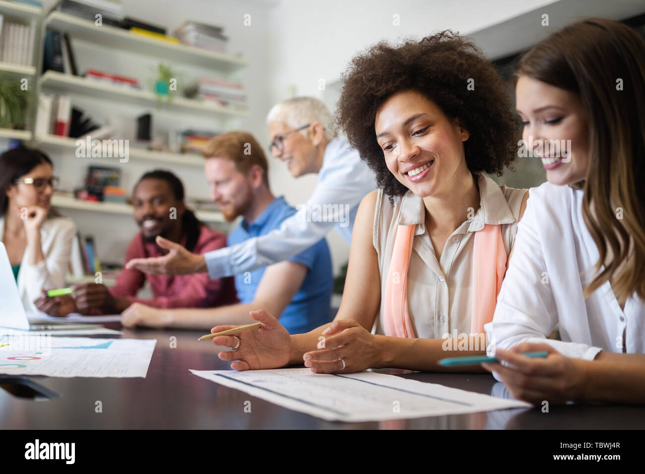 Group of successful business people at work in office Stock Photo - Alamy
