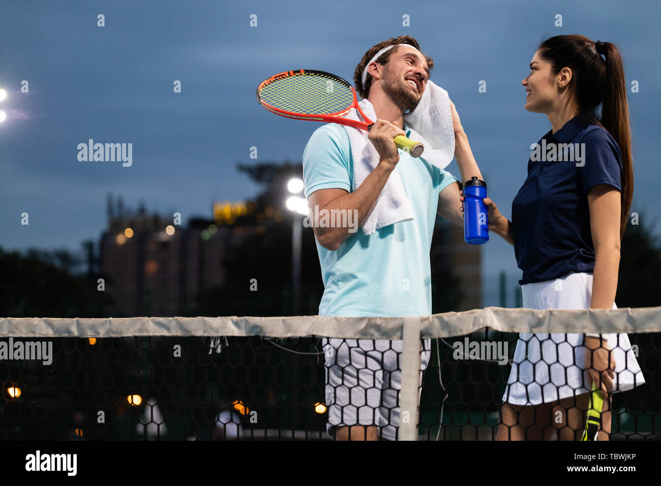 Group of healthy happy friends at the club playing tennis Stock Photo ...