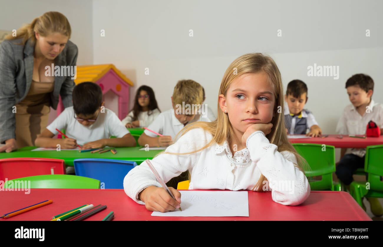 Teacher sad kid classroom hi-res stock photography and images - Alamy
