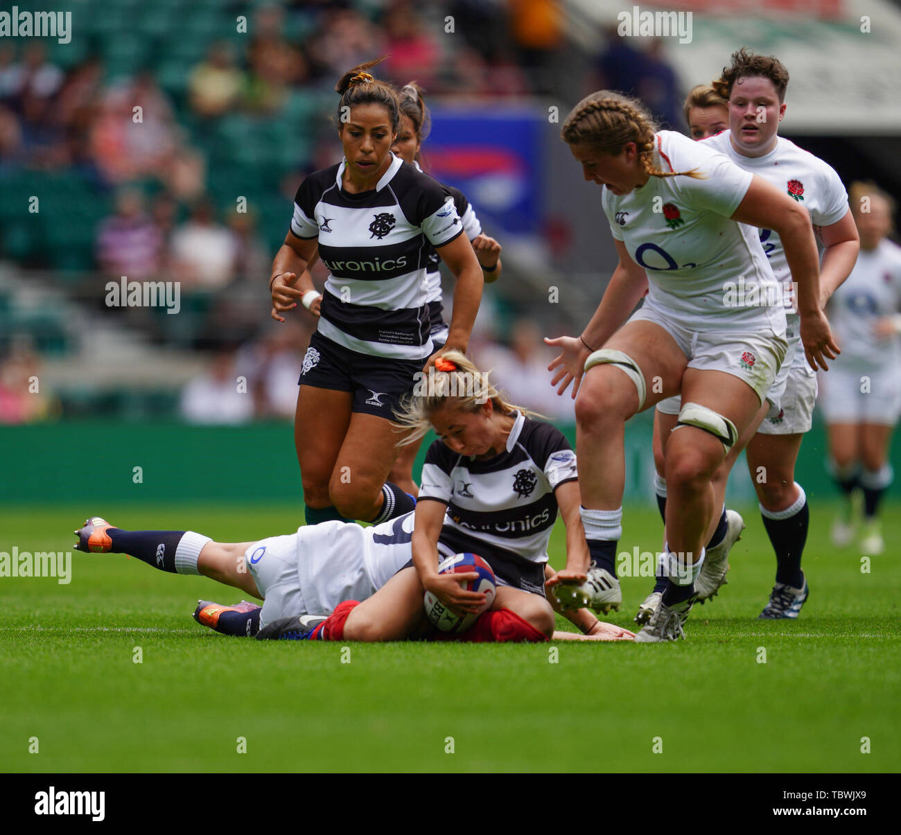 Elinor Snowsill tackled in action during the England v Barbarians Women ...