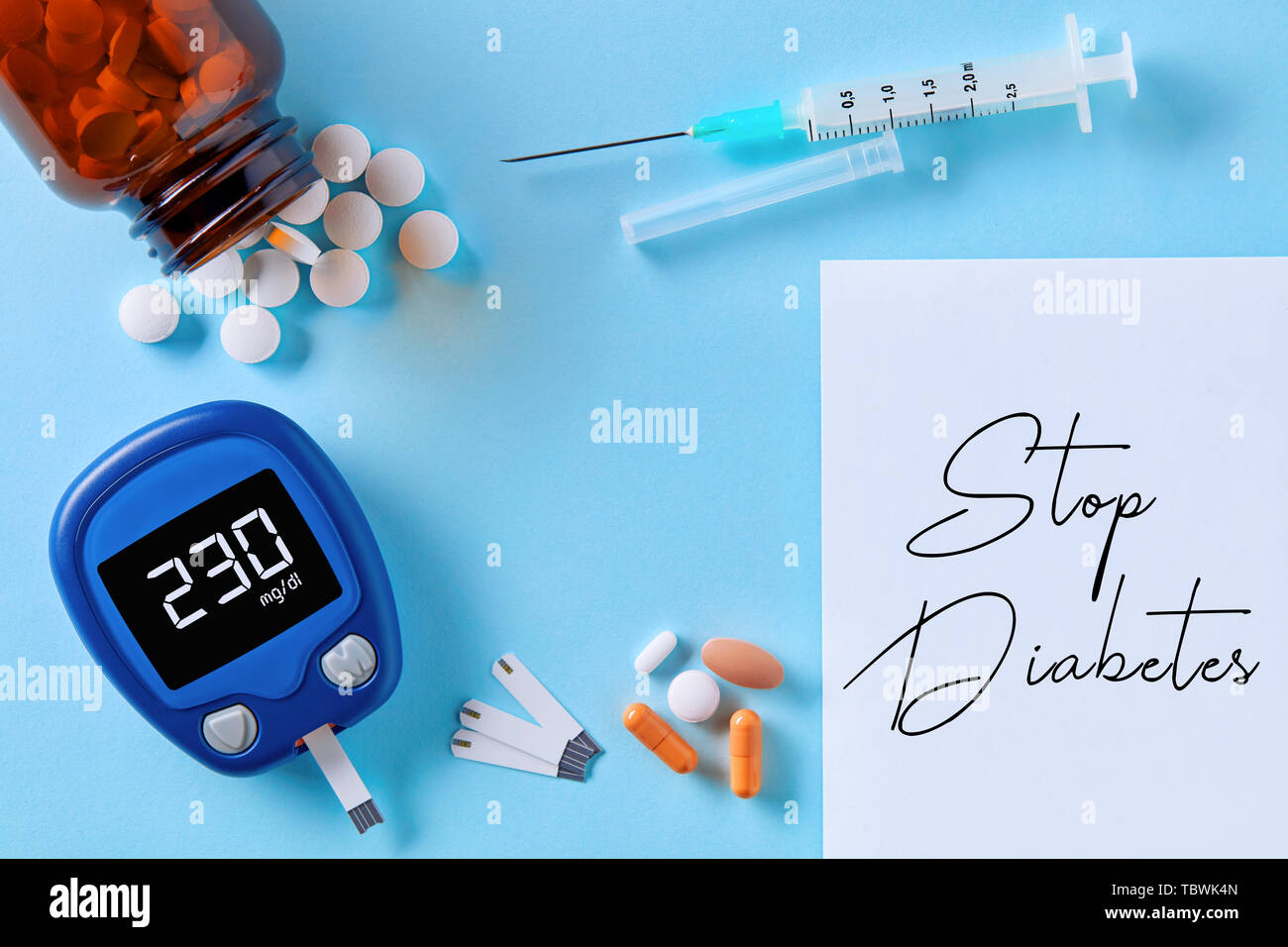 Stop diabetes concept. Close up top down view of glucose meter, drug ...