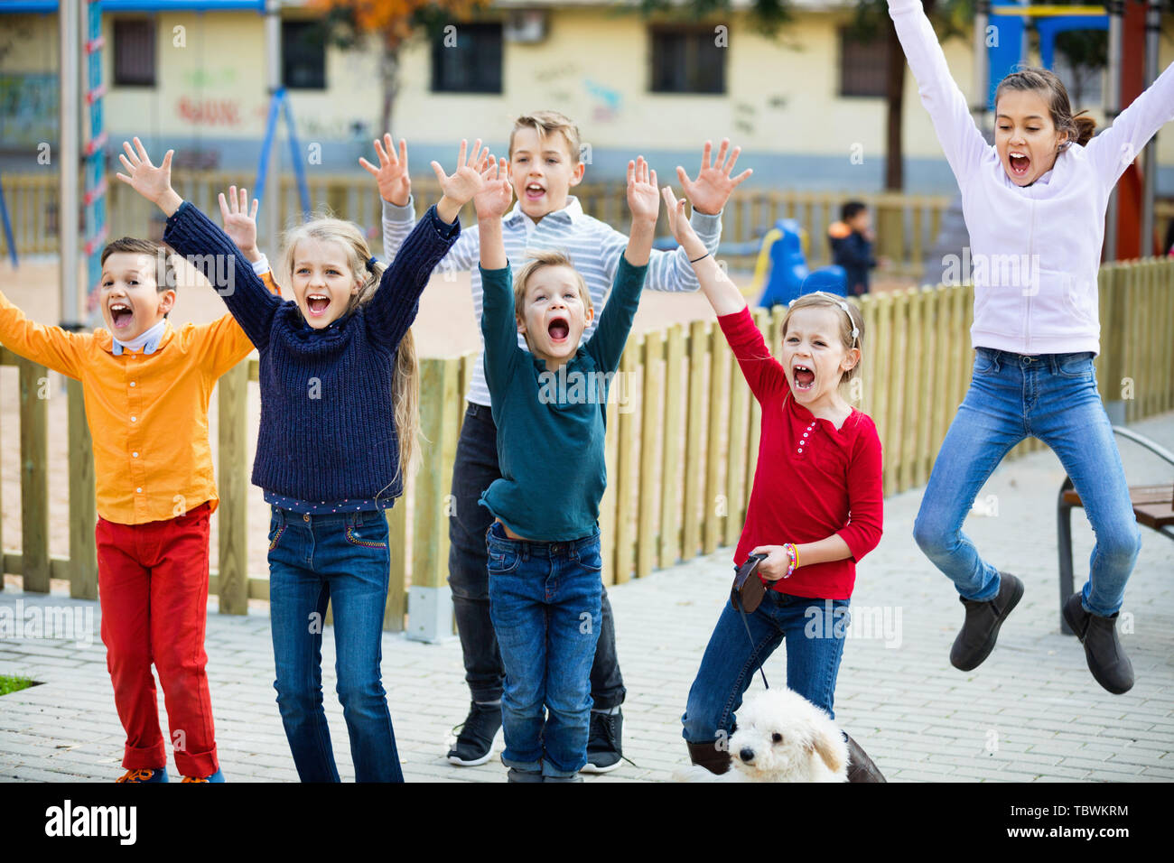 Happy cheerful laughing kids having fun and jumping up Stock Photo - Alamy