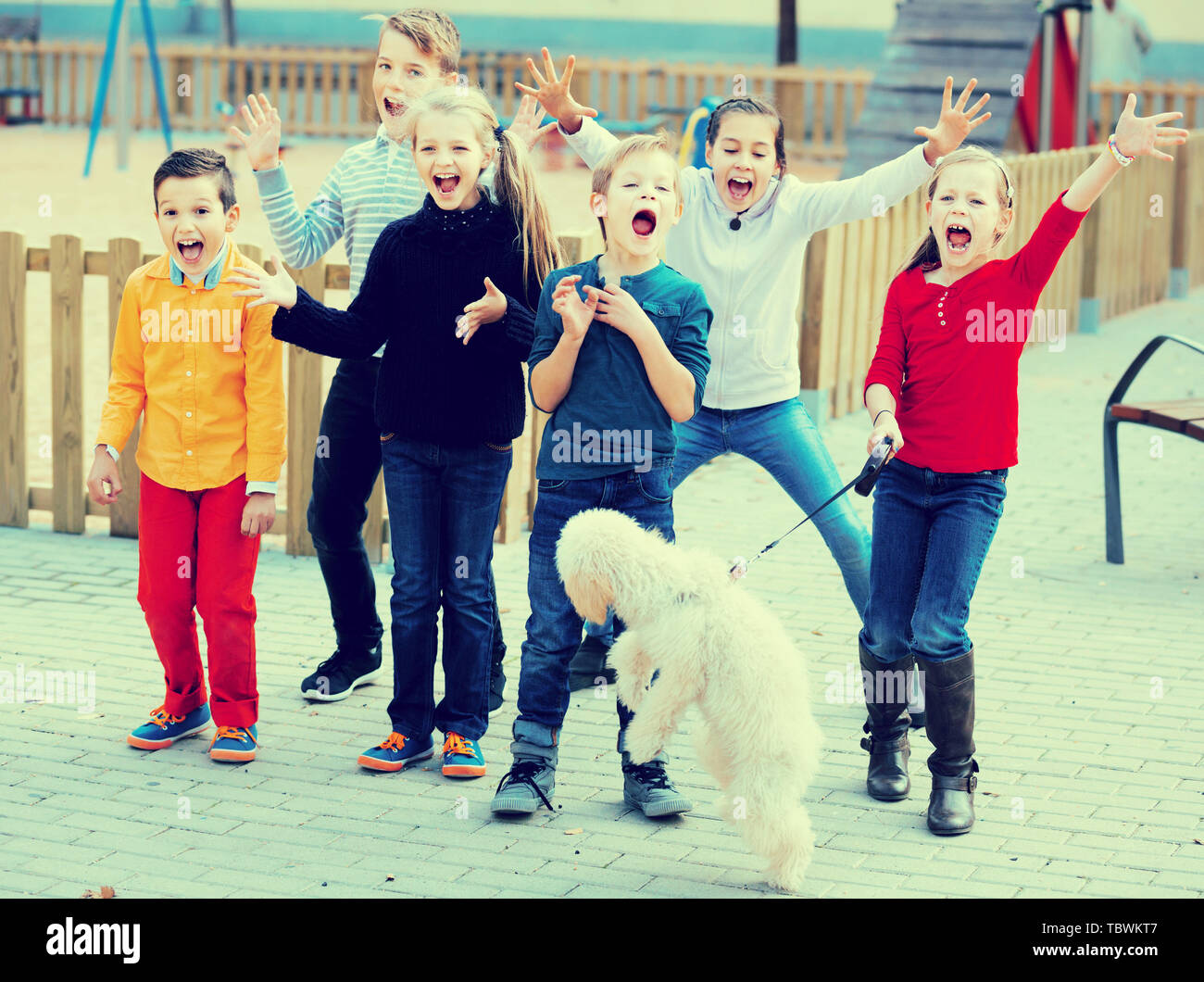 Group of glad children in high spirits jumping outdoors Stock Photo - Alamy