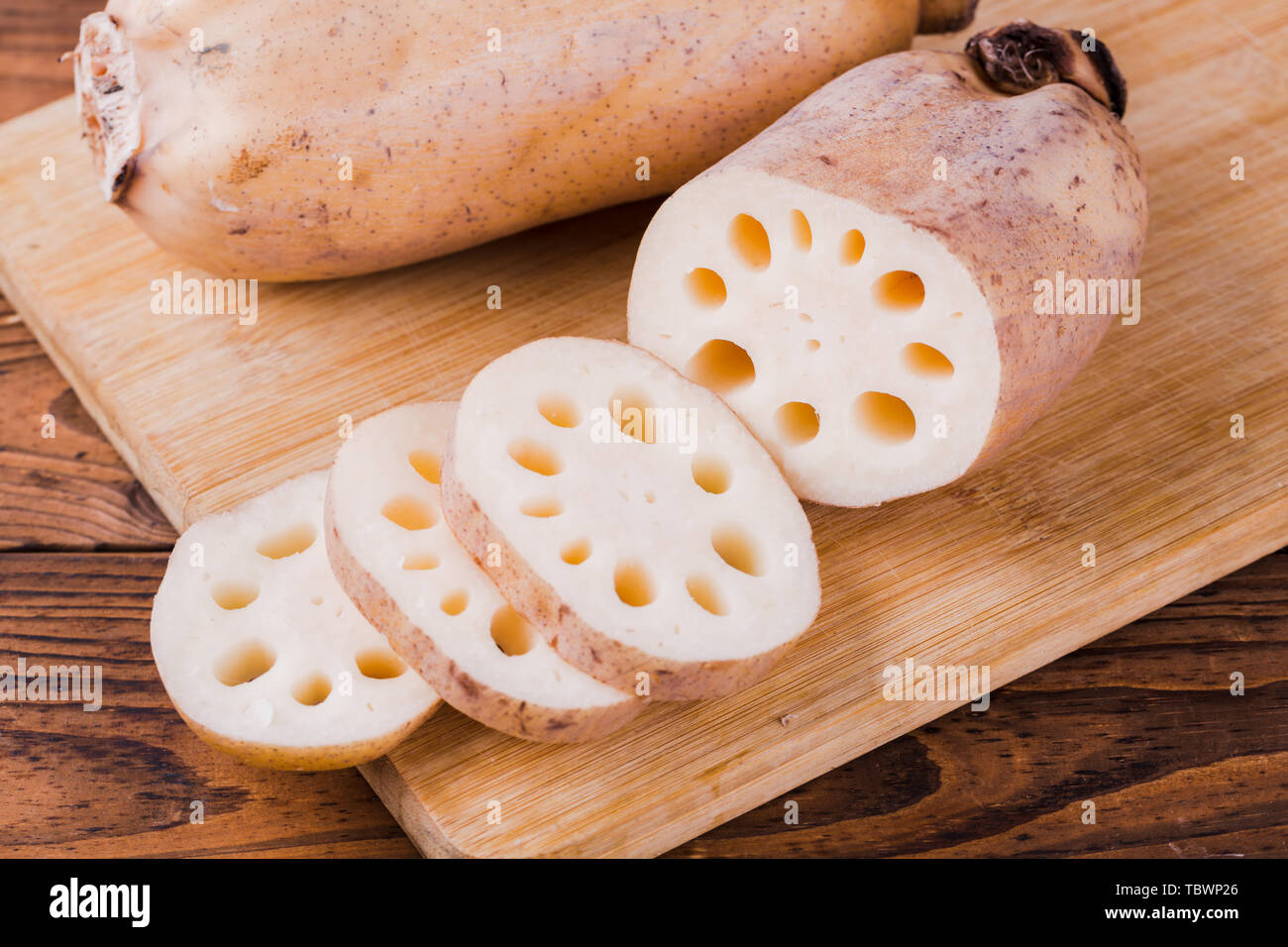 Fresh lotus root cut on the table, healthy and delicious ingredients ...