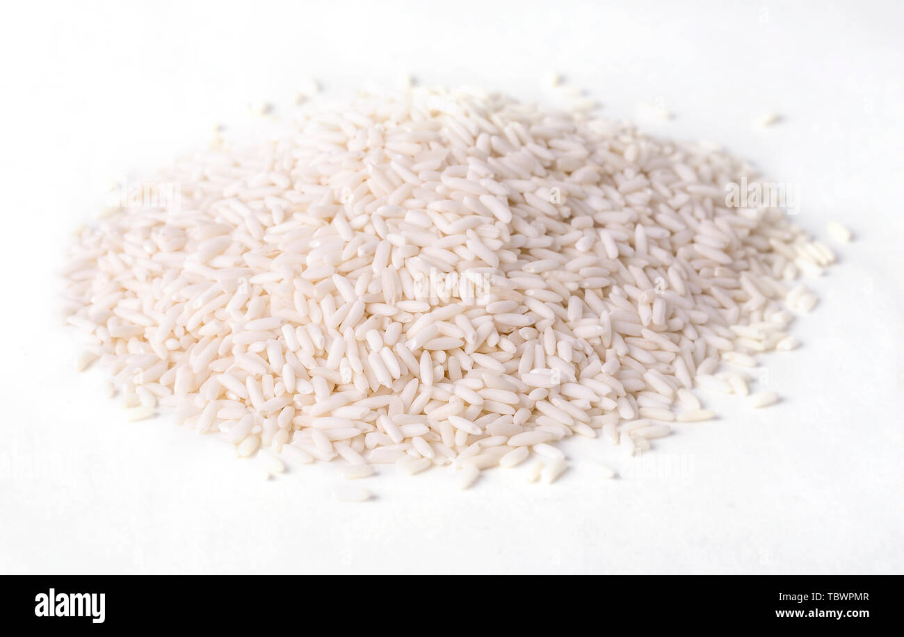 white rice isolated on a white background Stock Photo - Alamy