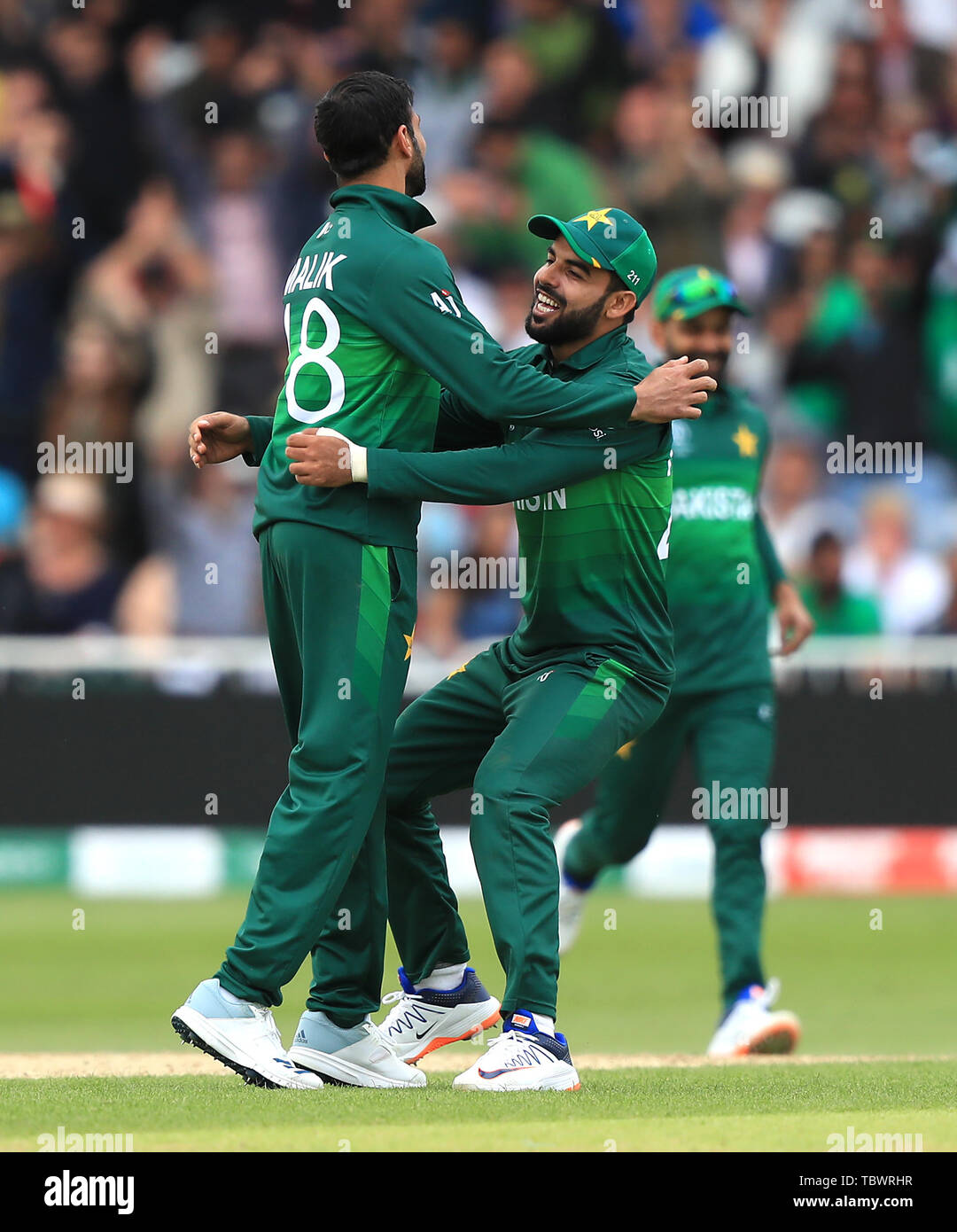 Pakistan's Shoaib Malik (left) and Shadab Khan (right) celebrate taking ...