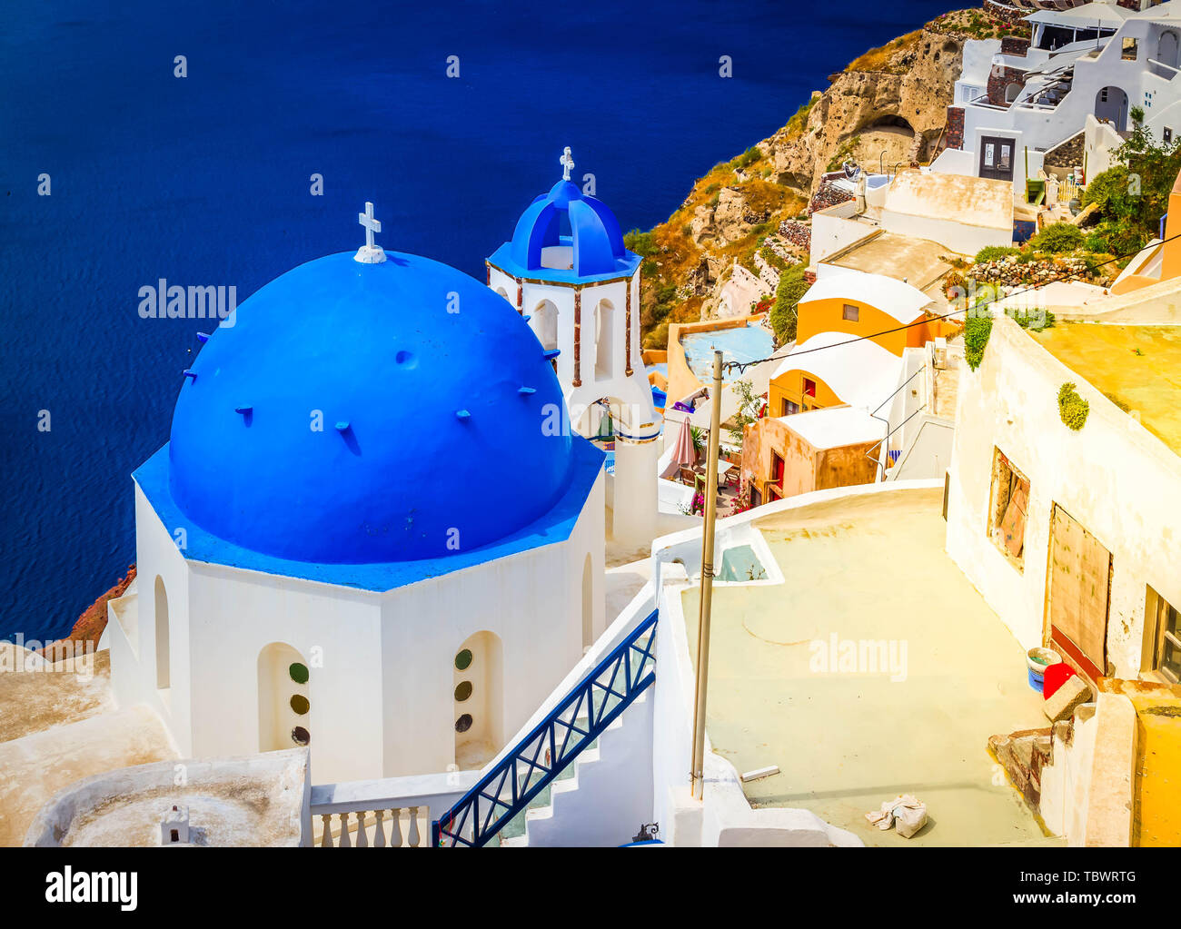 classical view of caldera with famous blue church domes, Oia, Santorini ...