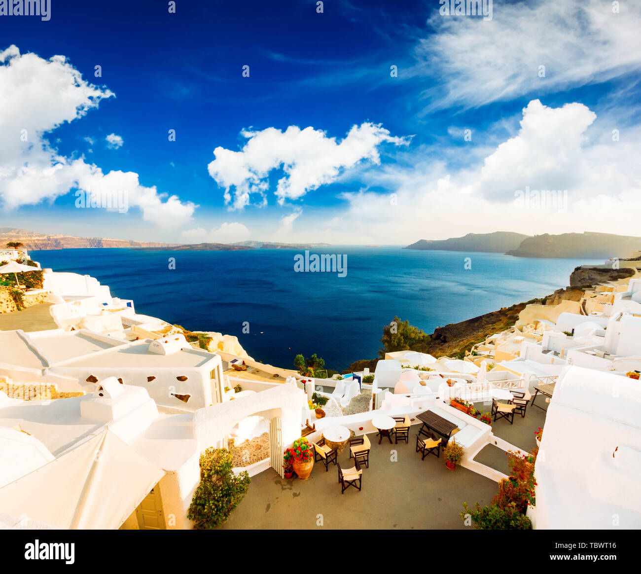 view of volcano caldera with white houses and Aehan sea waters ...