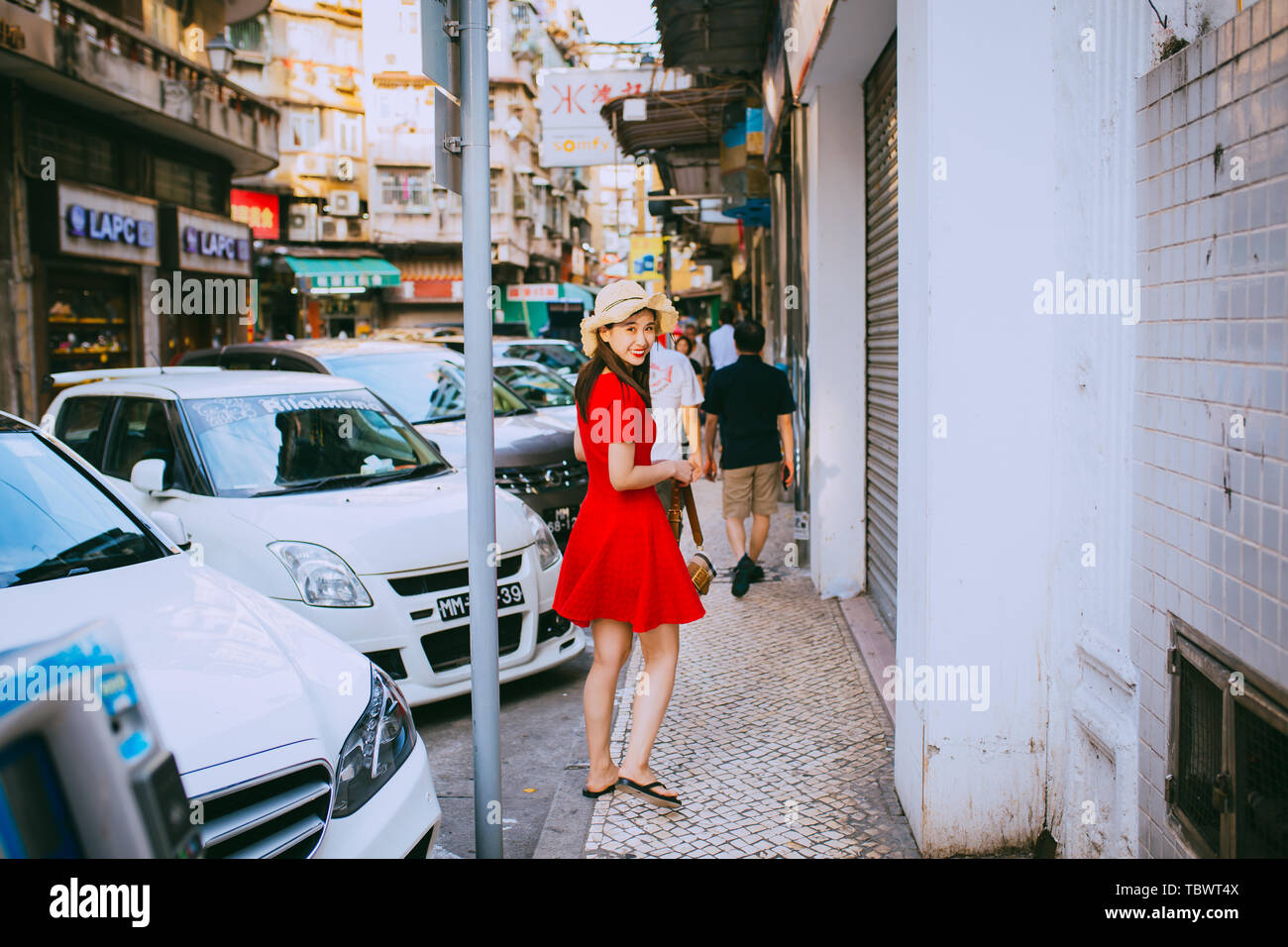 Red dress tour the big three buses Stock Photo - Alamy
