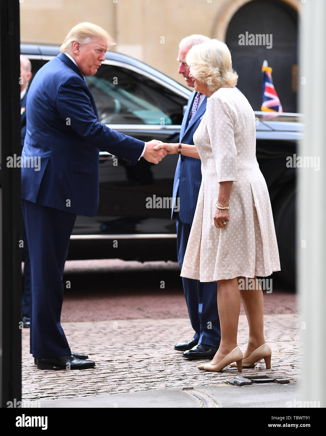 US President Donald Trump (left) arrives at Clarence House in London to ...