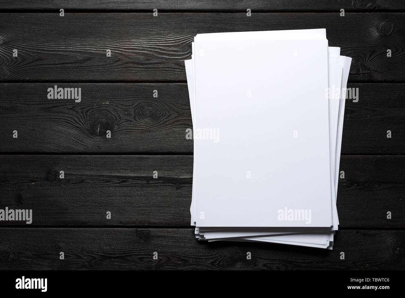White business card on wooden table. Blank portrait A4 Stock Photo - Alamy