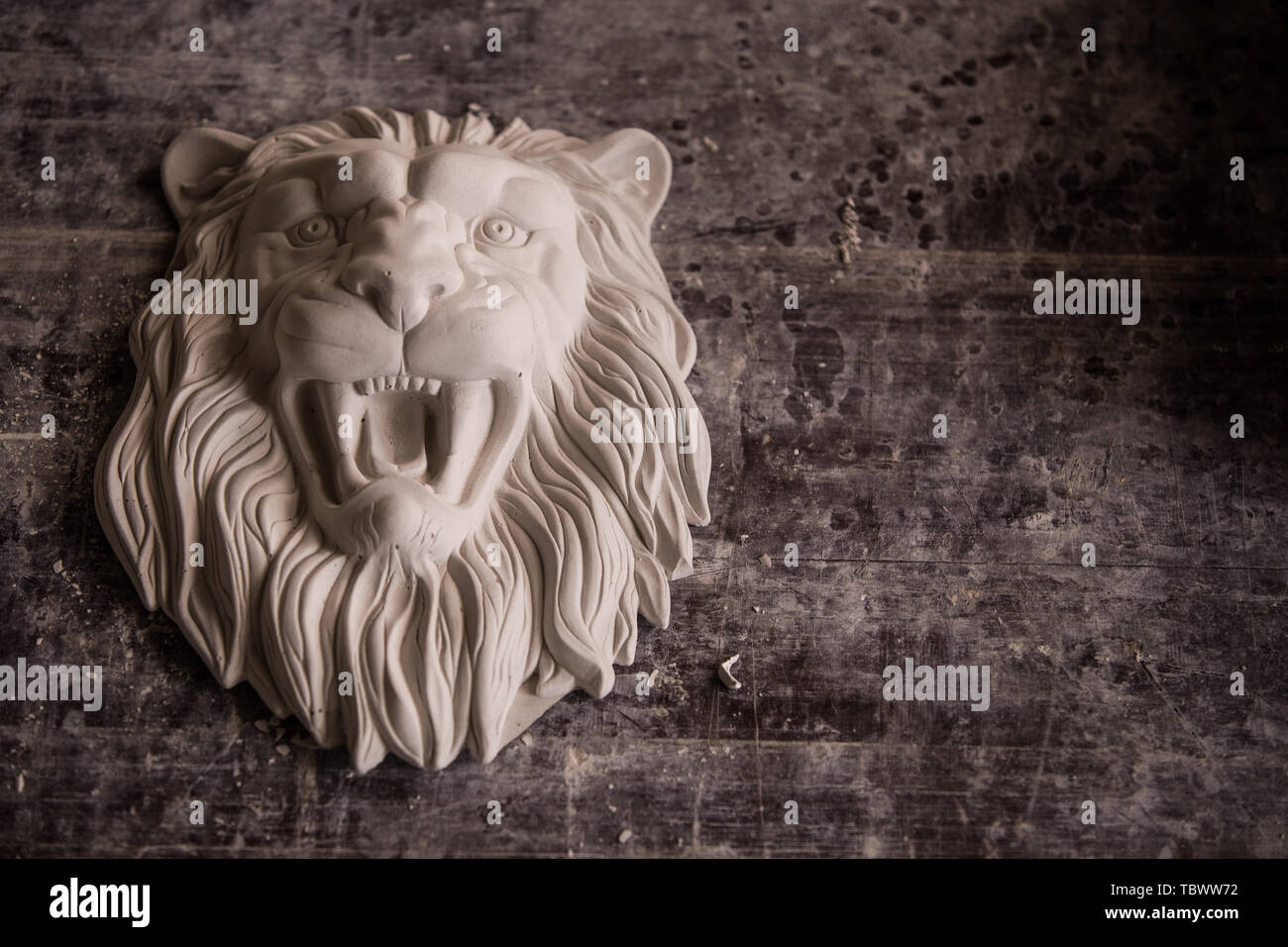 Creation of sculpture from plaster. Lion's head. Plaster workshop ...