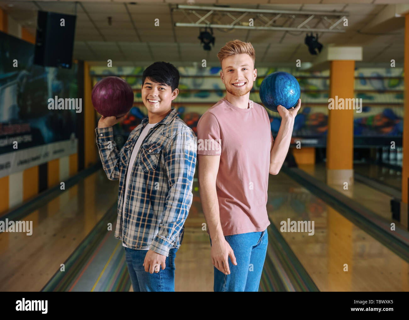 Portrait of friends in bowling club Stock Photo - Alamy