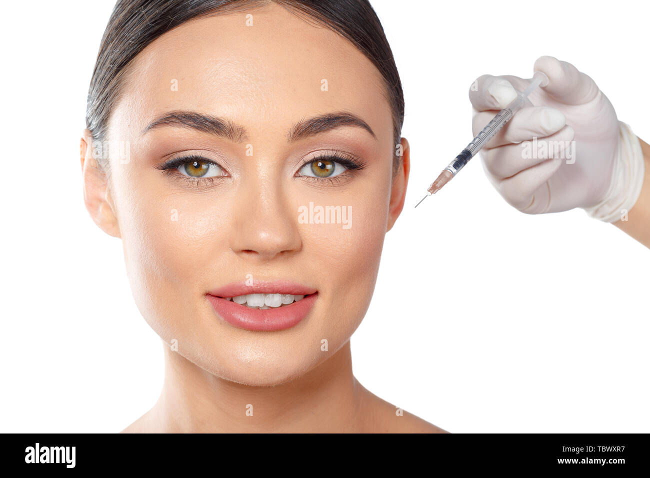 Portrait of an attractive young woman receiving botox treatment Stock ...