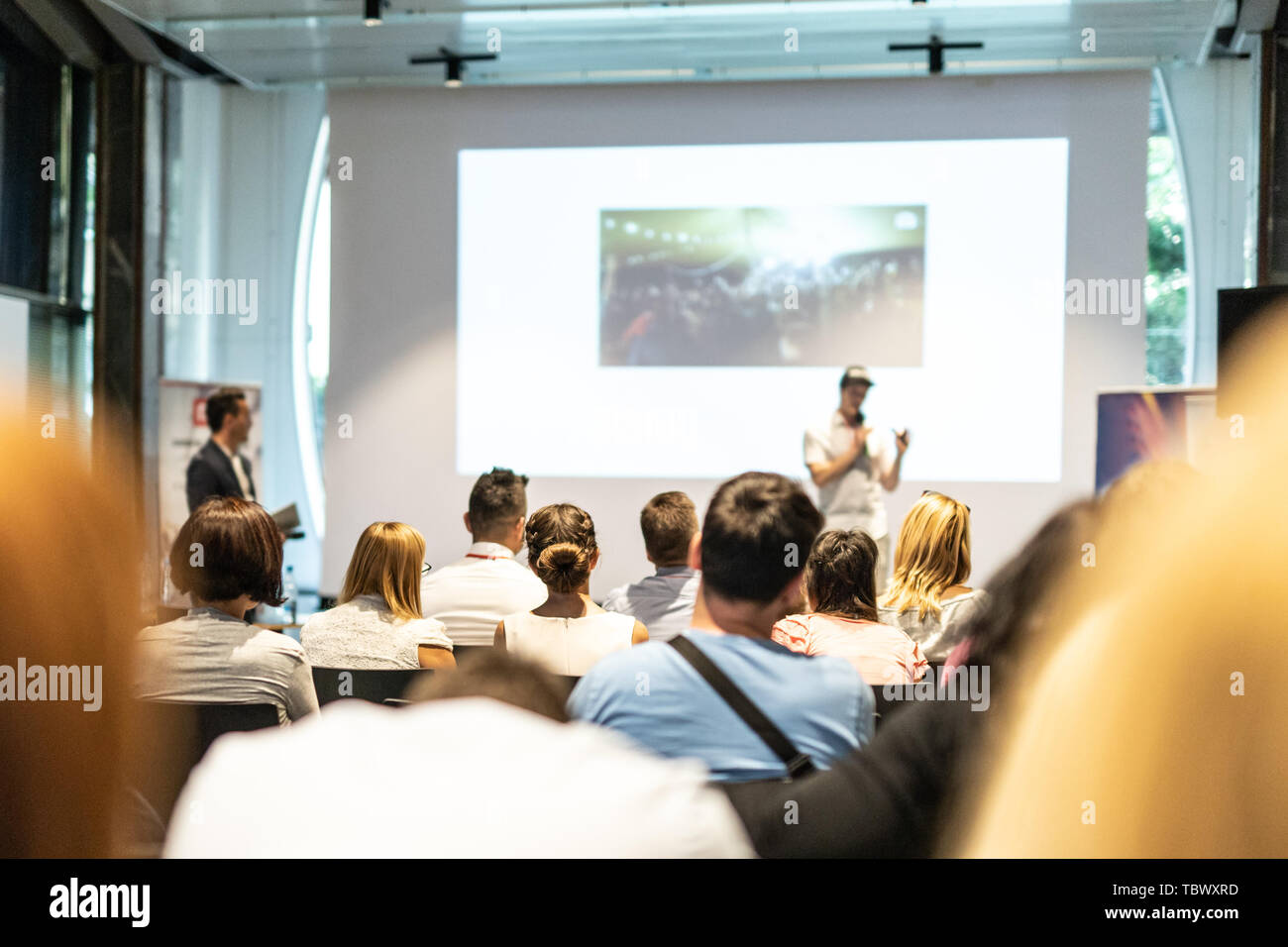 Male business speaker giving a talk at business conference event Stock ...