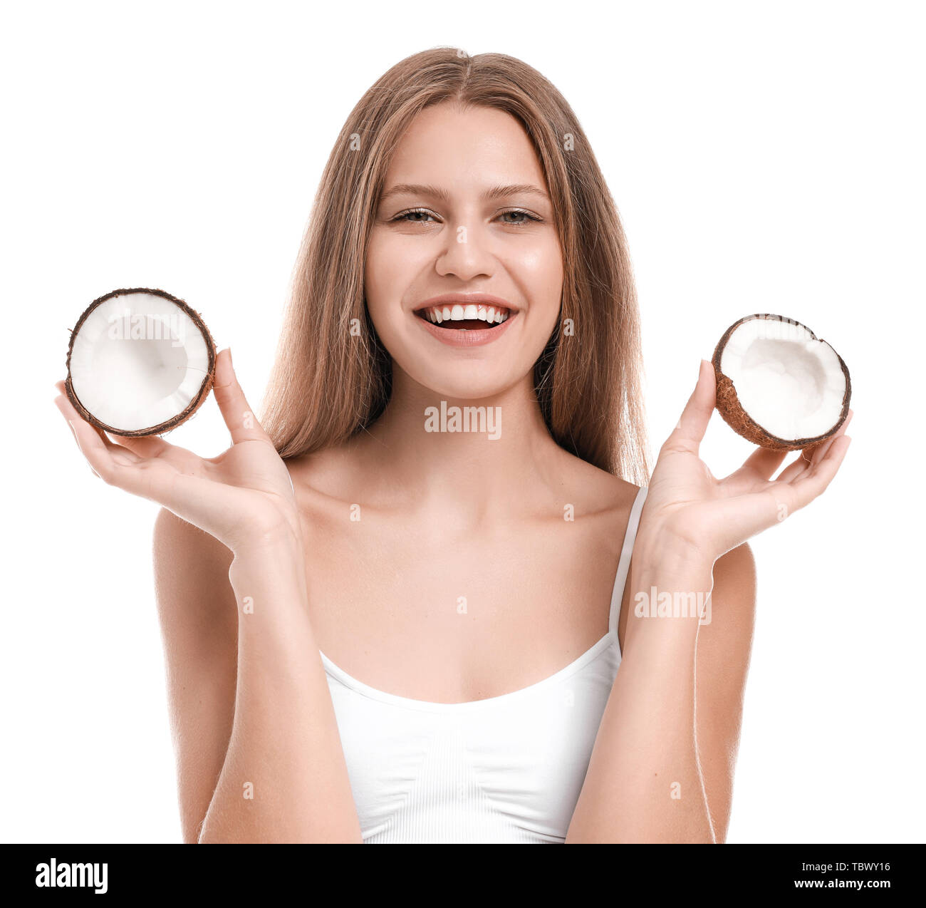Beautiful young woman with coconut on white background Stock Photo - Alamy