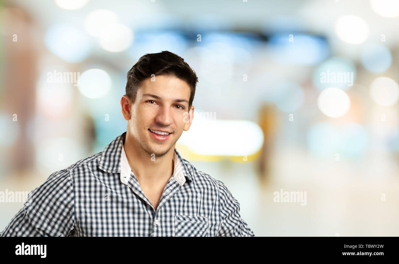 Handsome smiling young man Stock Photo - Alamy