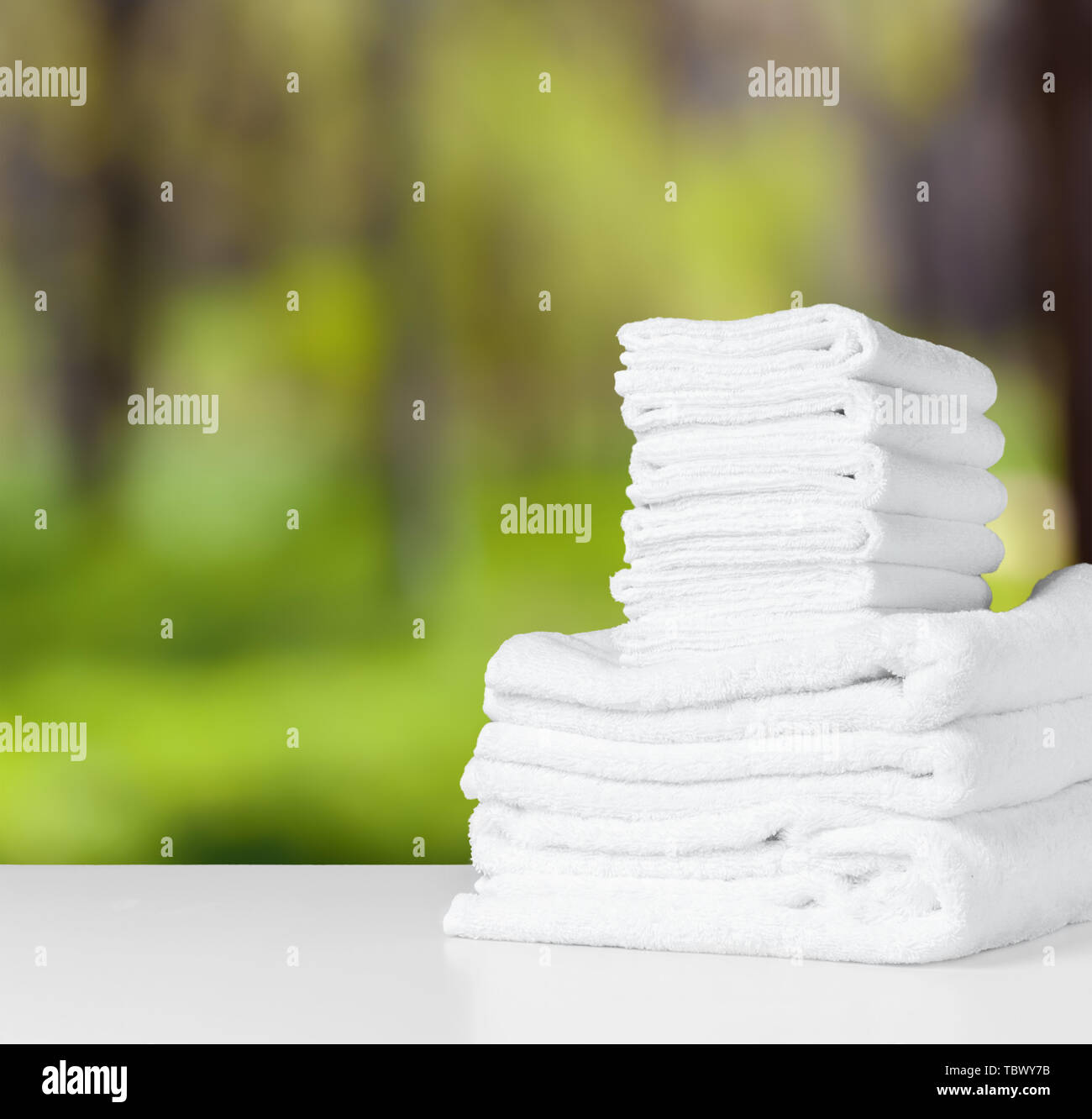 Stack of folded white spa towels Stock Photo - Alamy