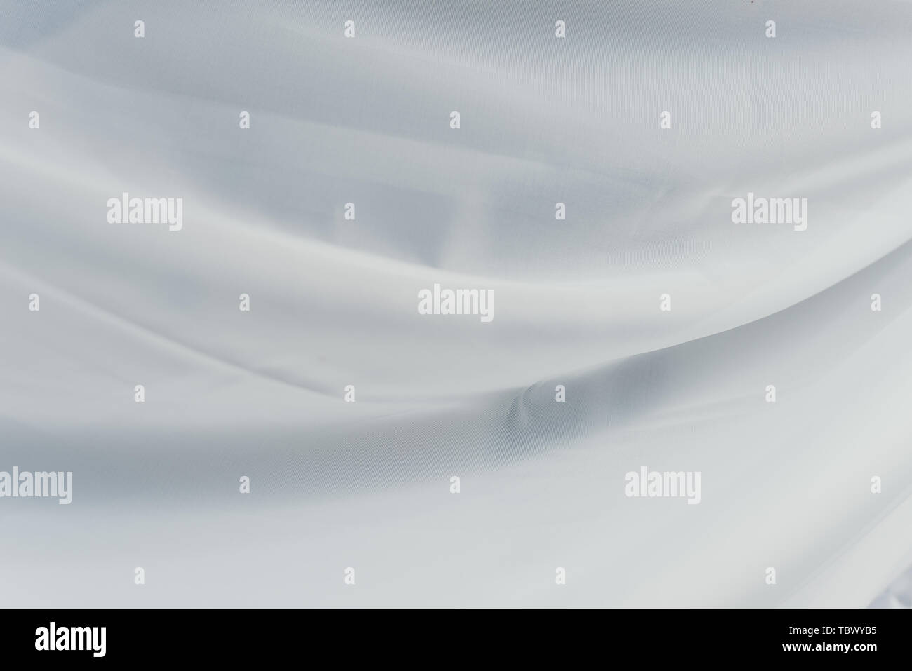 flying transparent fabric. white fabric with waves on it. curtain folds ...