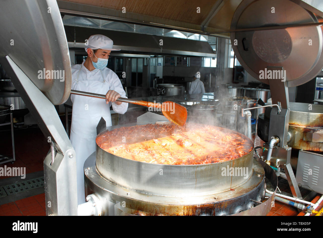 Food stir-frying processing Stock Photo - Alamy