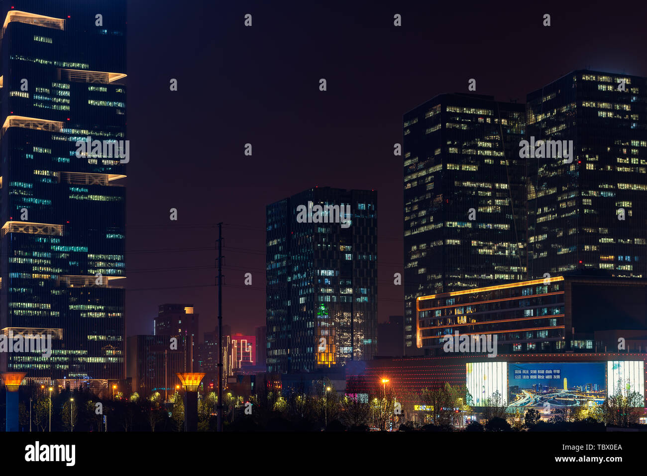 Night view of a modern glass skyscraper during overtime Stock Photo - Alamy