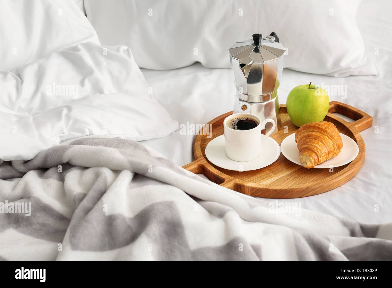Tray with tasty breakfast on bed Stock Photo - Alamy