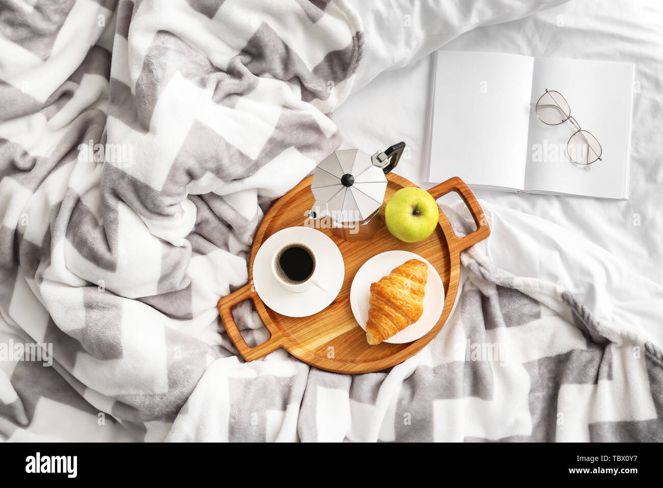 Tray with tasty breakfast on bed Stock Photo - Alamy