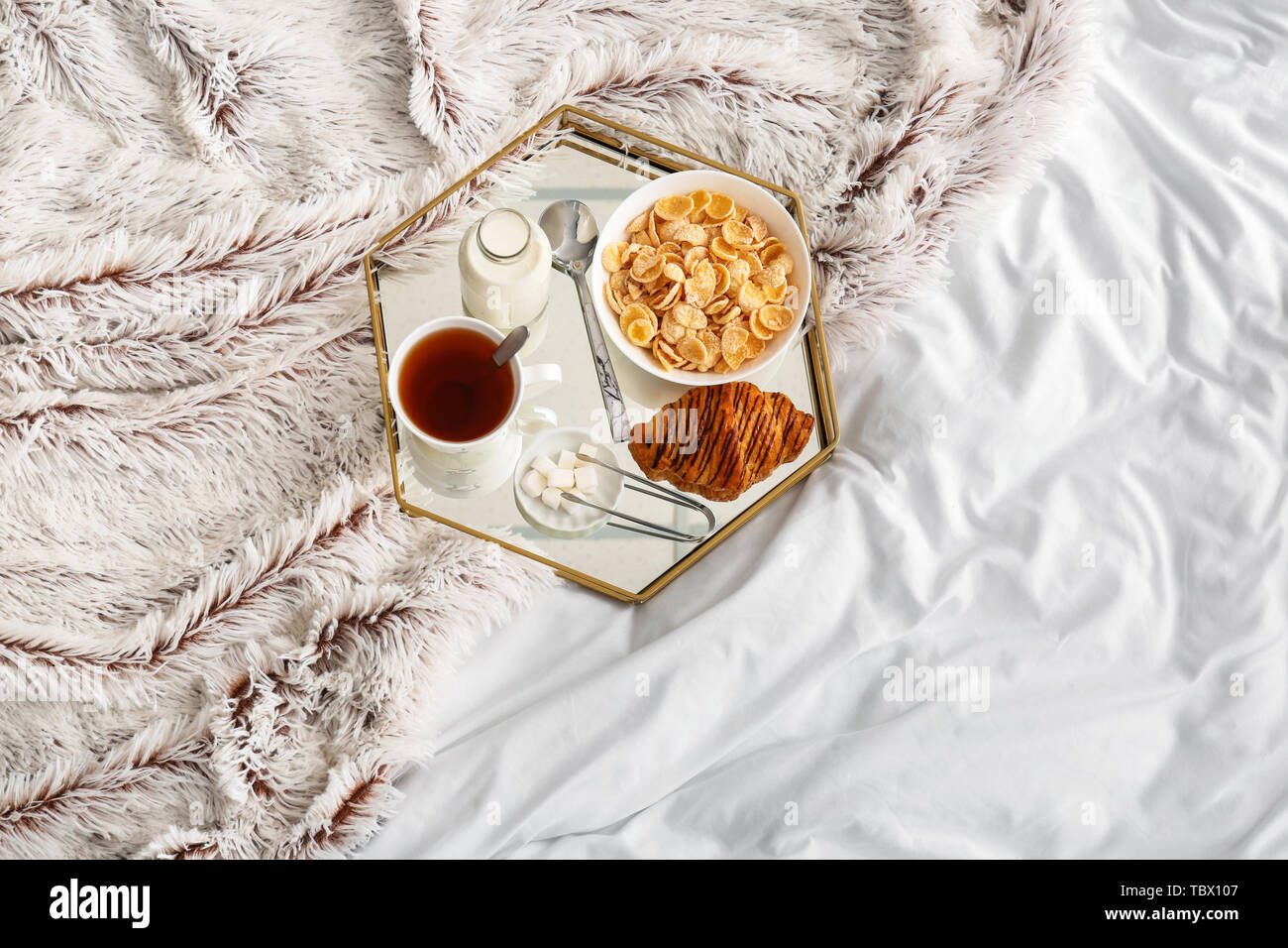 Tray with tasty breakfast on bed Stock Photo - Alamy