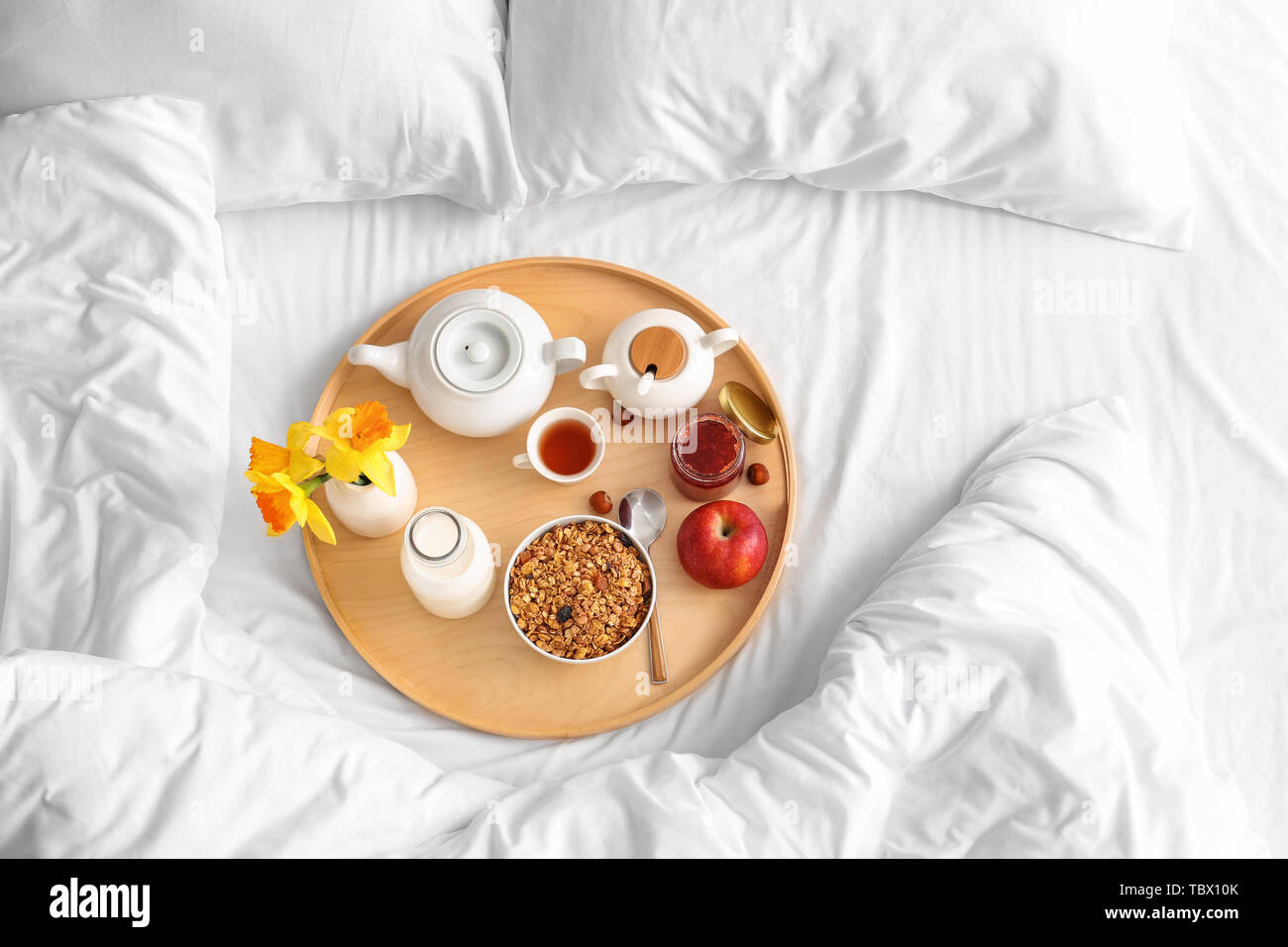 Tray with tasty breakfast on bed Stock Photo - Alamy