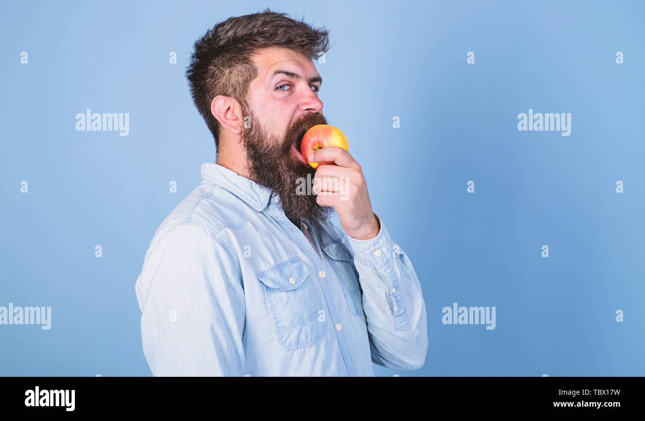 Man diet nutrition eats fruit. Healthy nutrition concept. Man handsome ...