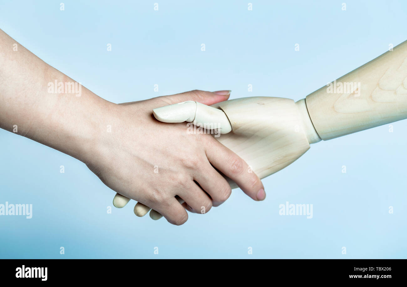 Artificial intelligence hands shake hands with humans close-up Stock ...