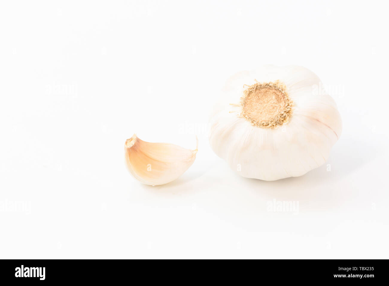 Garlic on white background Stock Photo - Alamy