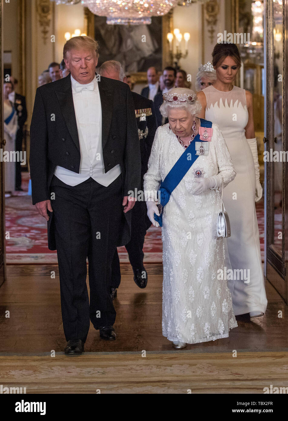 US President Donald Trump and Queen Elizabeth II arrive for a group ...