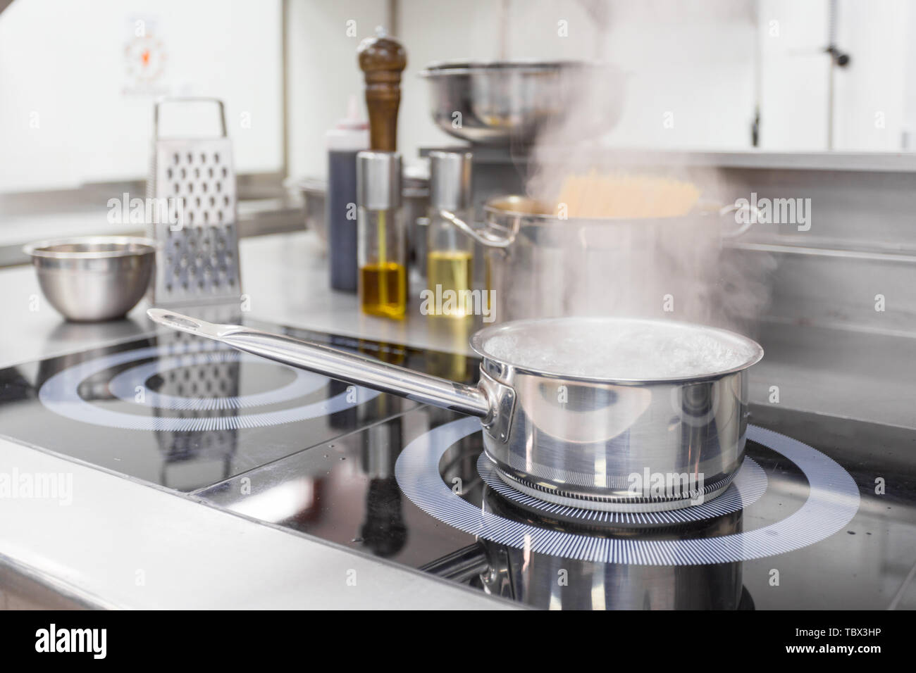 Stove counter in a modern restaurant kitchen Stock Photo - Alamy