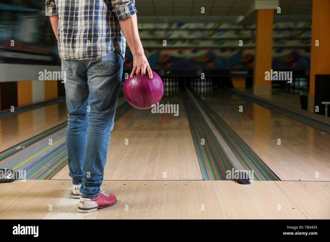 Man playing bowling in club Stock Photo - Alamy