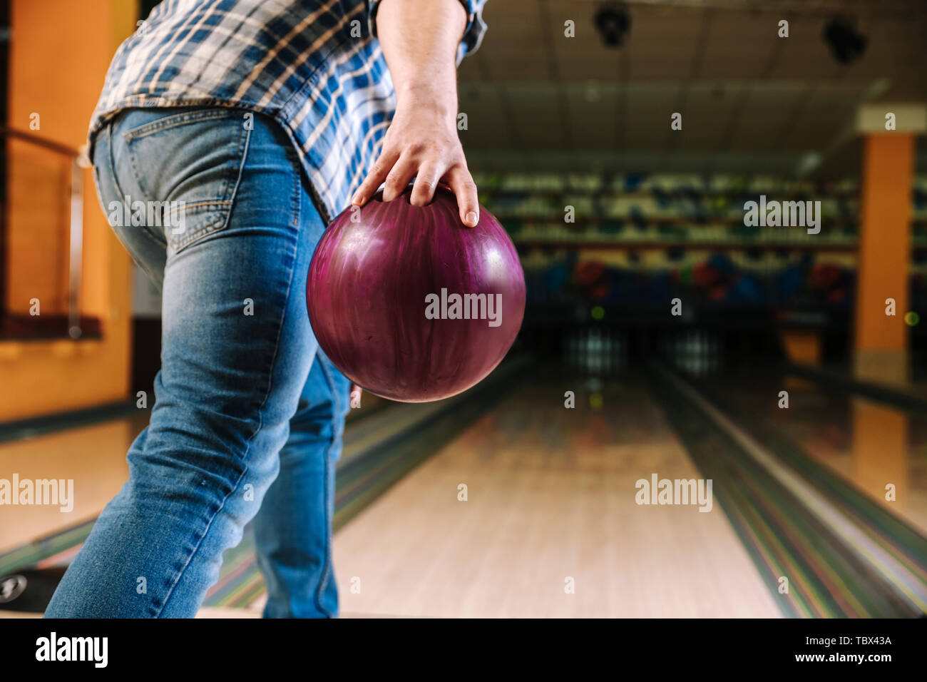 Man playing bowling in club Stock Photo - Alamy