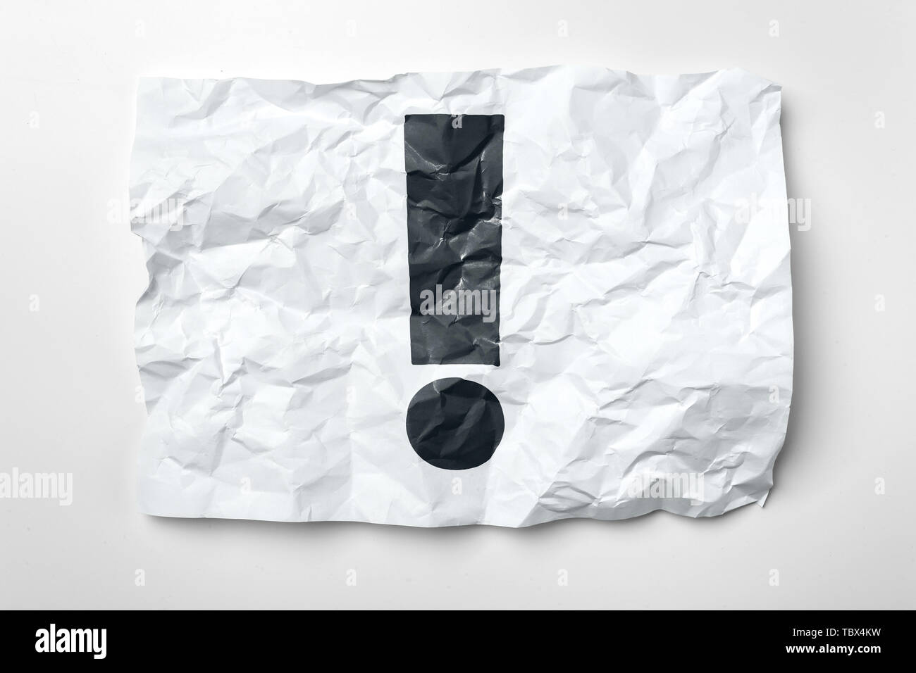 Exclamation point on a crumpled paper Stock Photo - Alamy