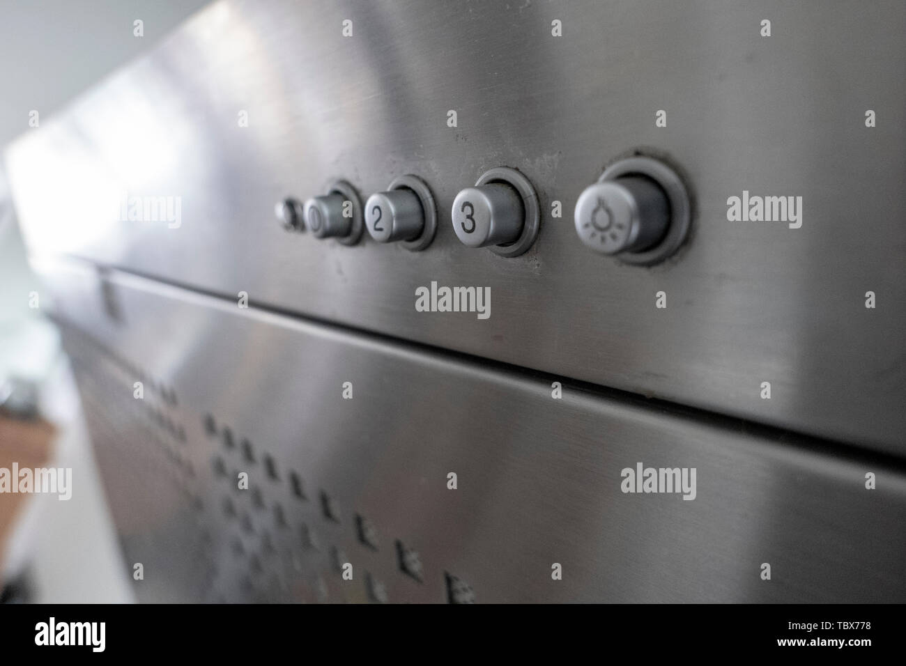 Operating elements of a silver extractor hood with light switch Stock ...