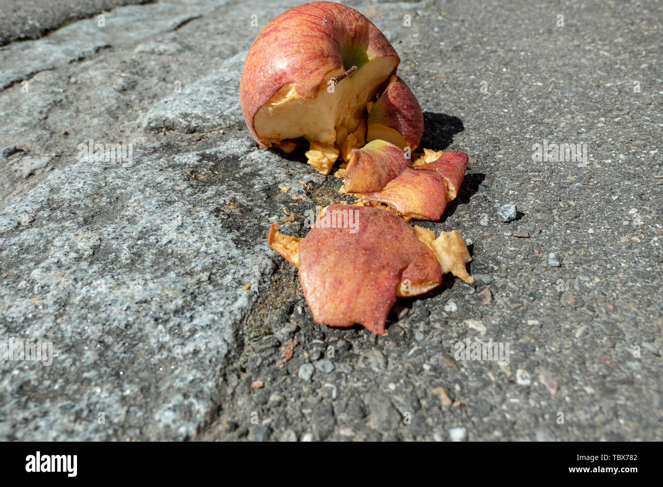 crushed apple directly on the road on the asphalt Stock Photo - Alamy