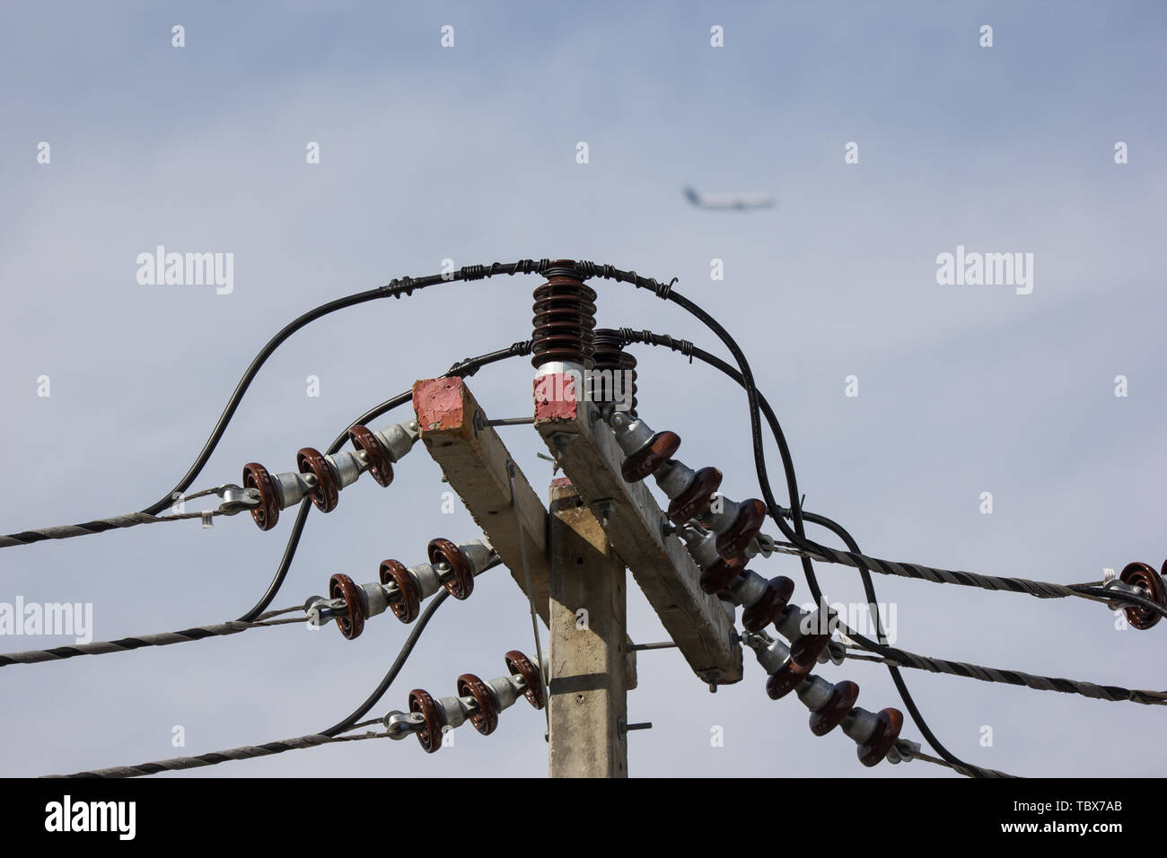 Closeup Eletricity line and electricity post wtih blue sky background ...