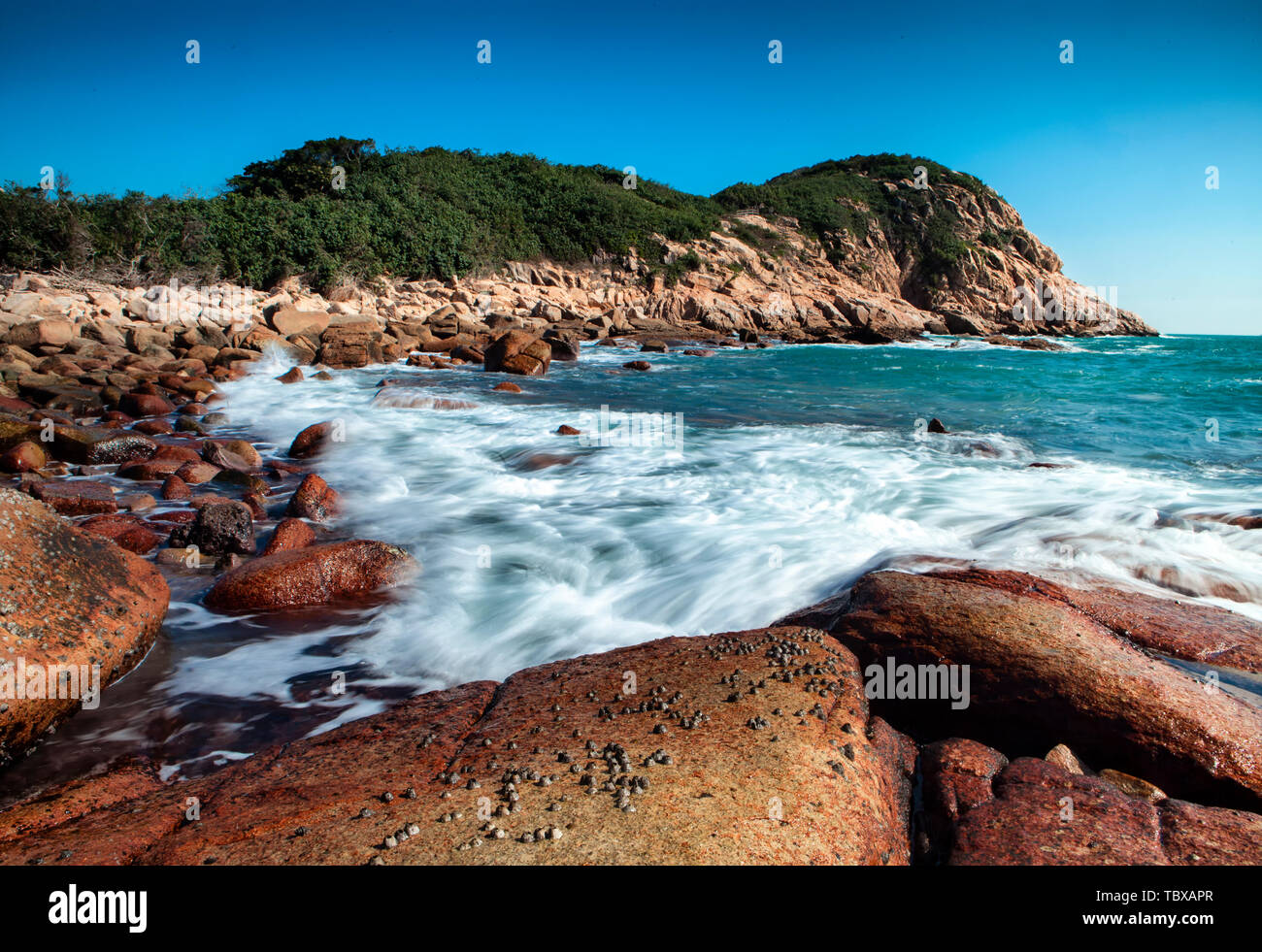 Shek O, Hong Kong, a Mediterranean-style town with a blue sea and white ...